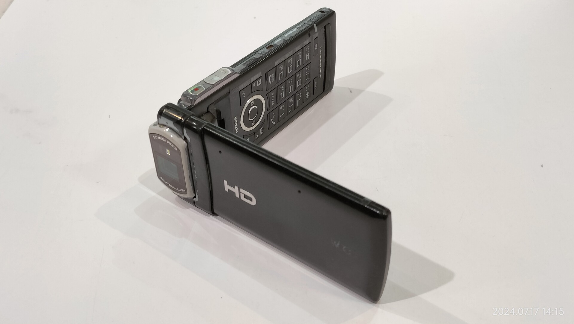 2009/平成21/au/HITACHI/Mobile Hi-Vision CAM Wooo/500万画素/3倍光学ズーム/ビデオカメラ ...