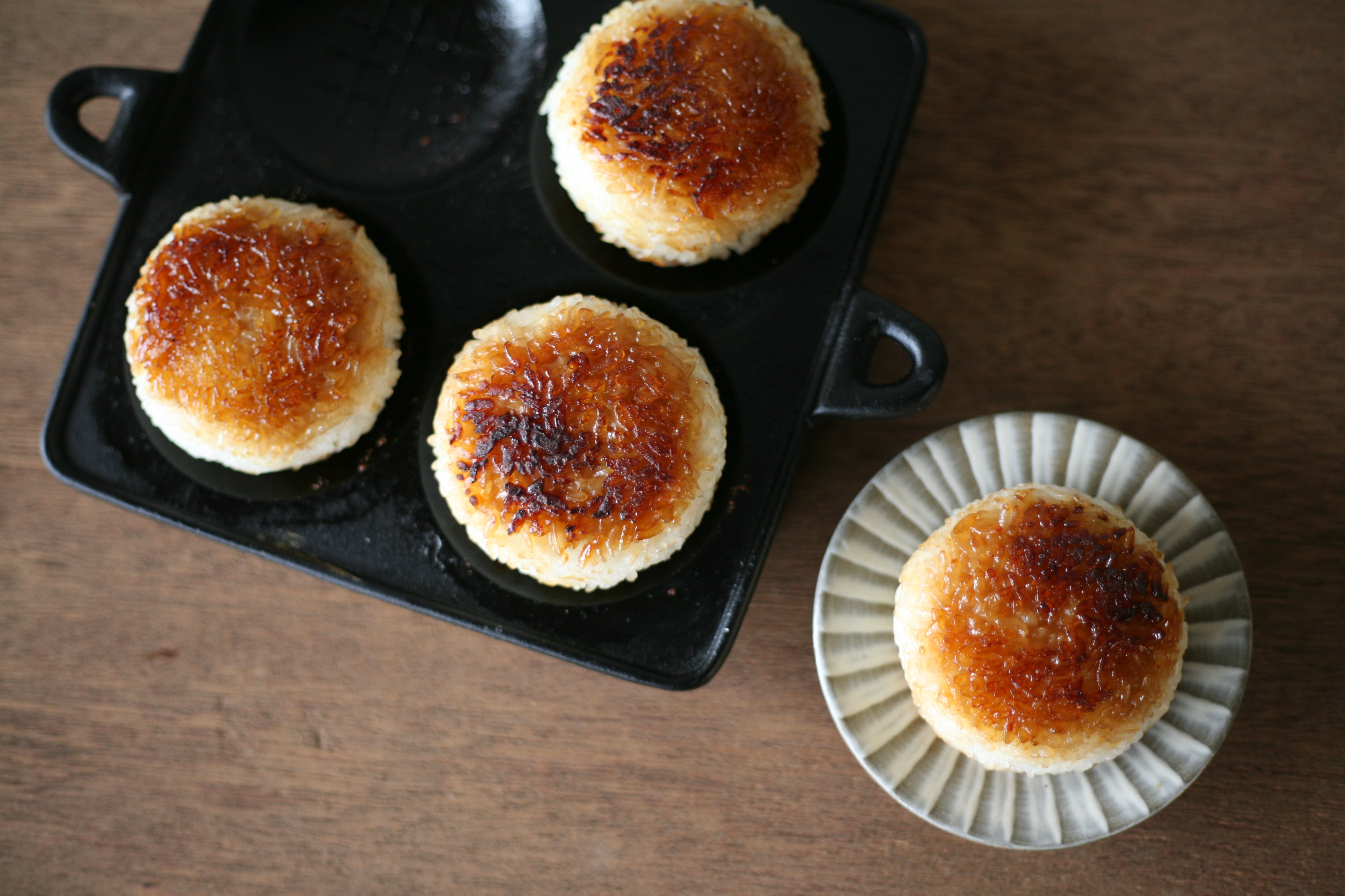 Onigiri is a dish that pressure-forms rice in shapes of either triangle ...